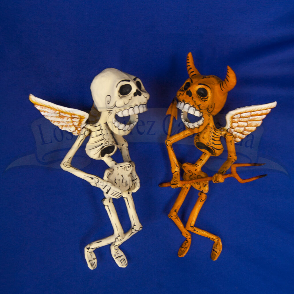Calavera móvil de ángel y diablito - Los Ramírez Castañeda